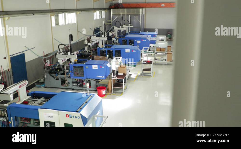 Machines And Conveyors At The Packaging Area Of An Injection Molding ...