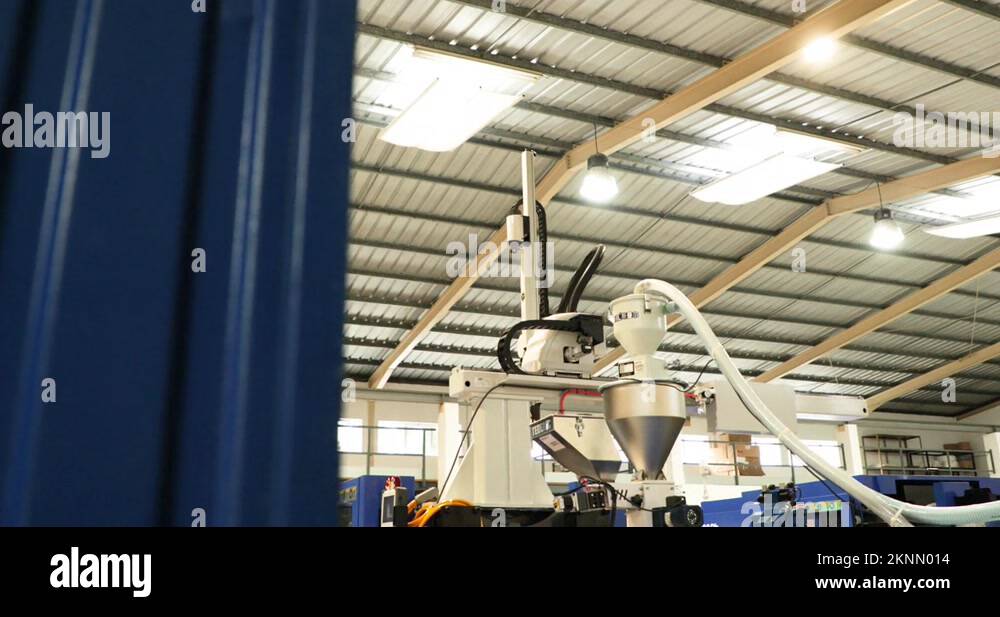 Plastic Recycling Machine At Work In An Injection Molding Factory ...
