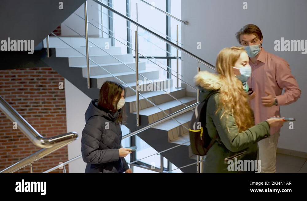 Employee scans QR codes at the entrance to the building from visitors Checking Stock Video ...