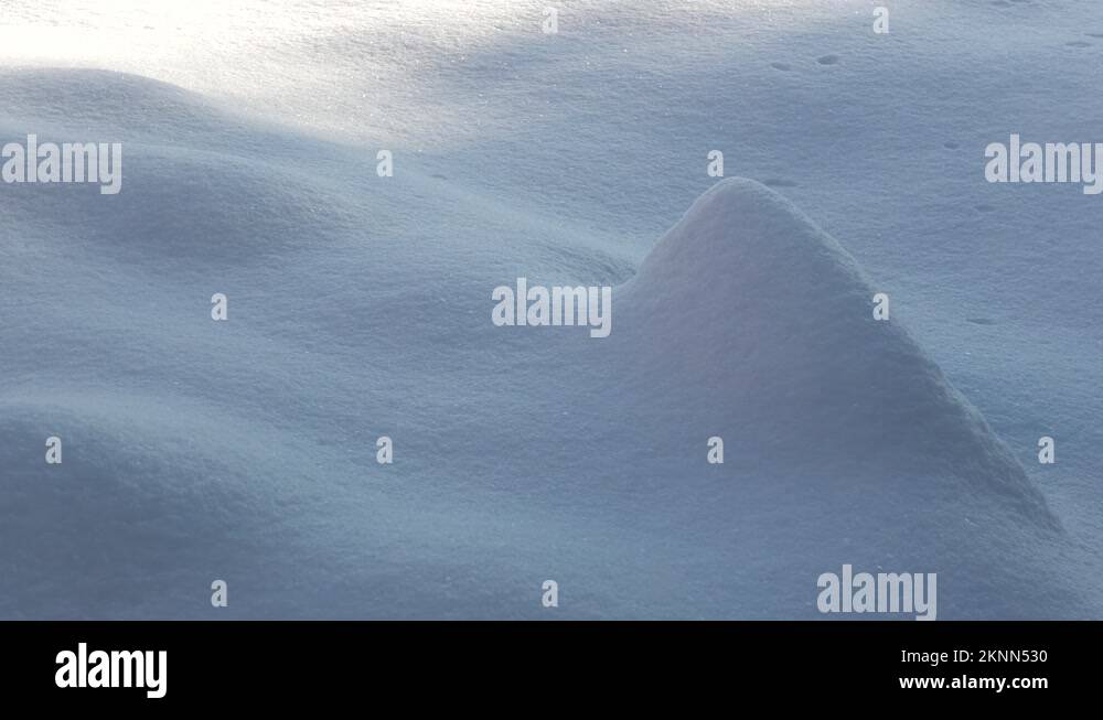 Soft, fluffy snow forming peaks on the ground Stock Video Footage - Alamy