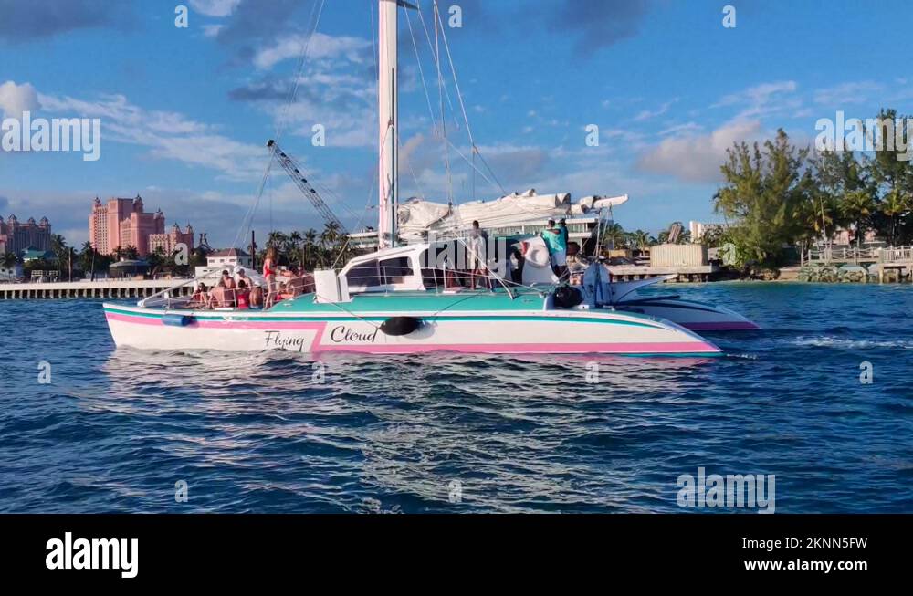 Party boat full of people having fun near Paradise Island in The ...
