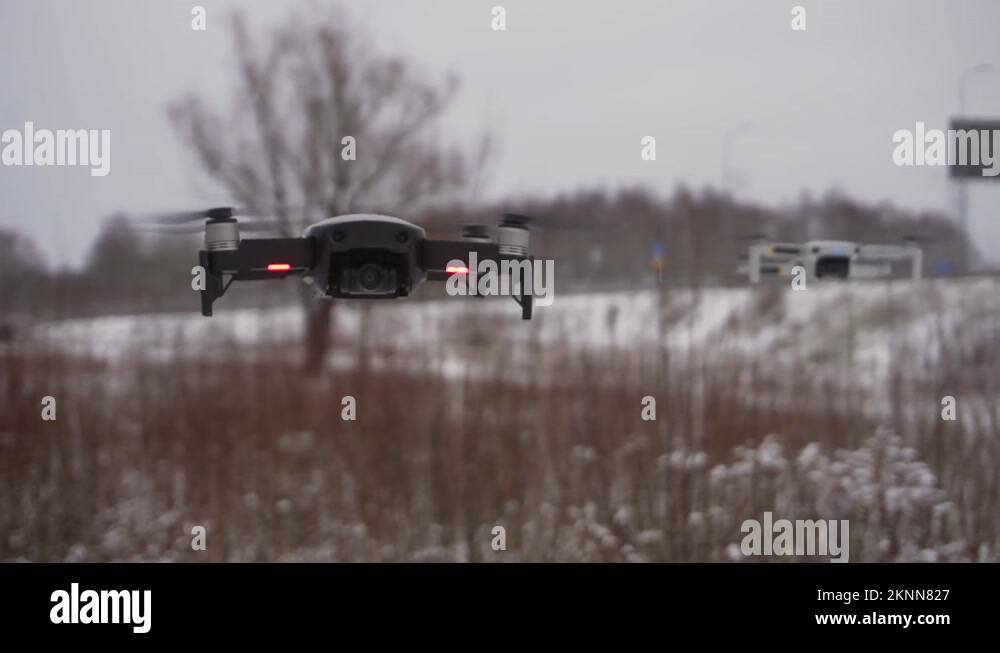 Close-up aerial of drone flying in mid-air. DJI Mavic Air and Mavic ...