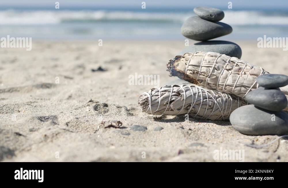 Rock balance on ocean beach, stones stack by sea water waves. Pyramid ...