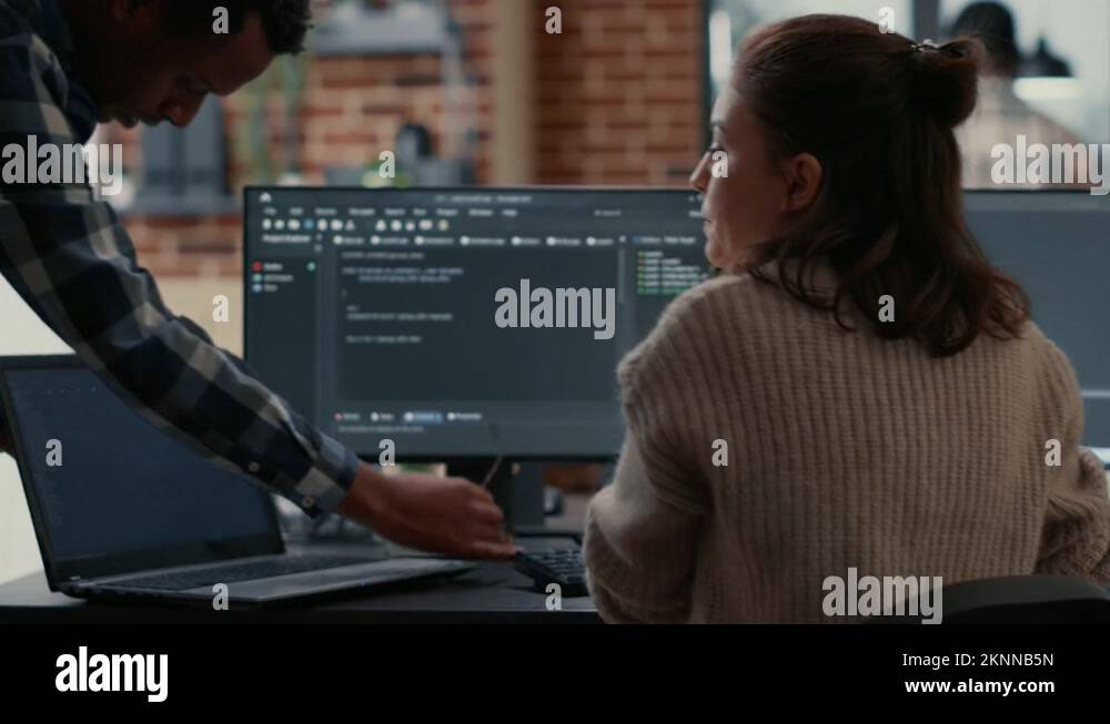 Software Programer Putting Laptop With Source Code On Colleague Coder Desk Stock Video Footage