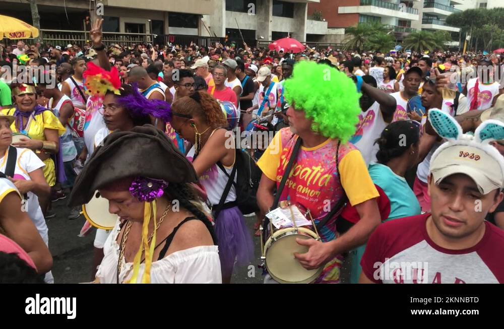 People with costumes, wigs and make ups enjoying Bloco, part of the ...