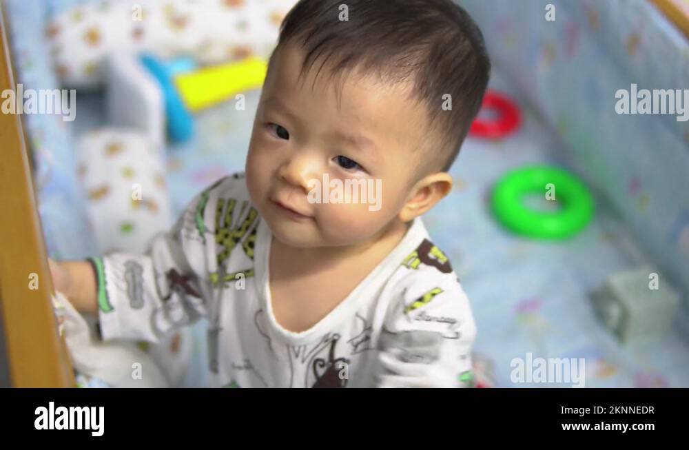 portrait footage of 10 month old Asian Chinese baby boy looks and move around Stock Video ...