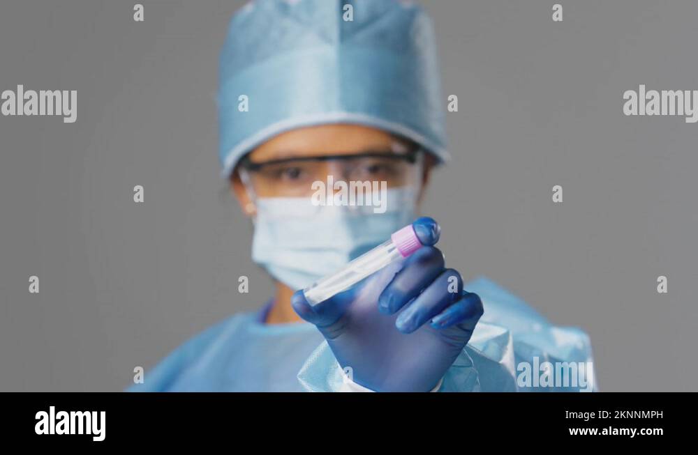 Female Lab Research Worker Wearing PPE And Safety Glasses Holding PCR ...