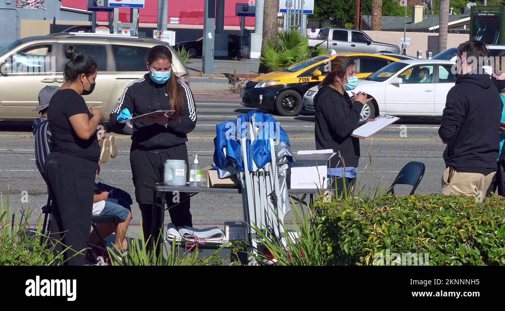 Young people getting tested by nurses for coronavirus Covid-19 ...