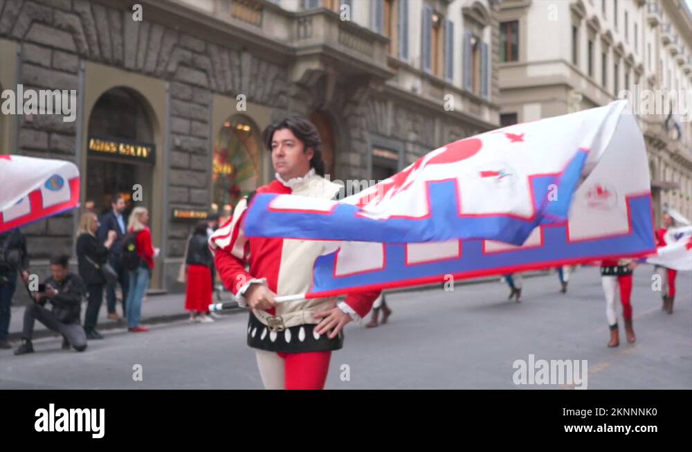 Parade by men in traditional costume through the streets of Florence ...