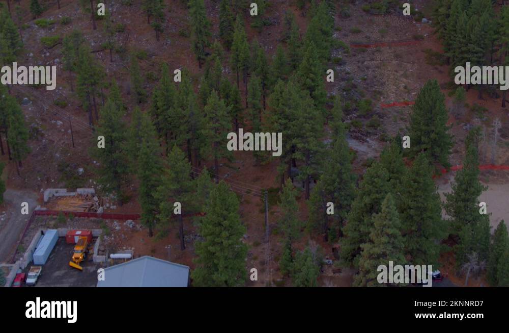 Flyover park ranger headquarters and parking lot and up mountainside ...