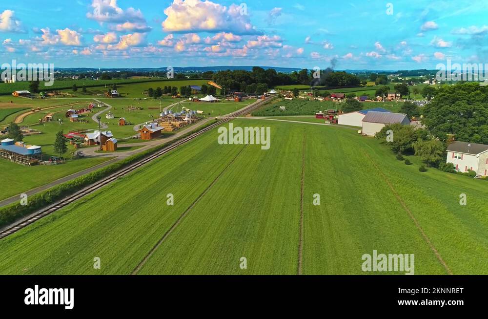 An Aerial View of Amish Farm lands With a Single Rail Road Track and a ...