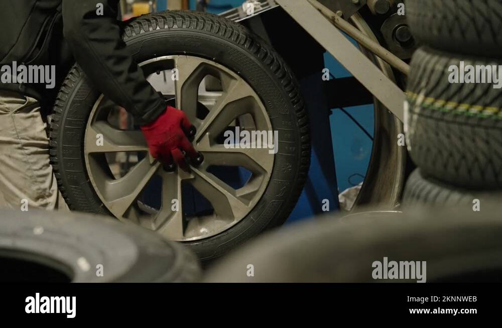 Close-up of a wheel that is mounted by operator on a machine for ...