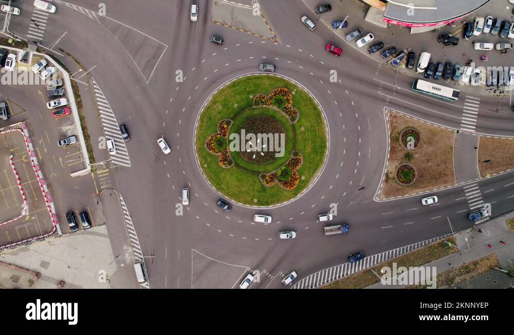 Traffic circle with many cars. Top down aerial view on a circular ...