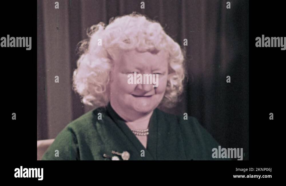 1960s: Older Albino woman in green dress and pearls. Dr. George W ...