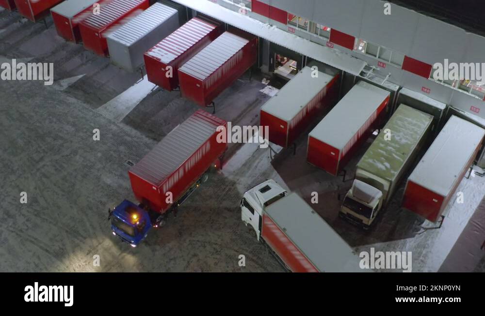 Semi-trailer truck drives off a warehouse ramp after loading and unloading goods Stock Video ...