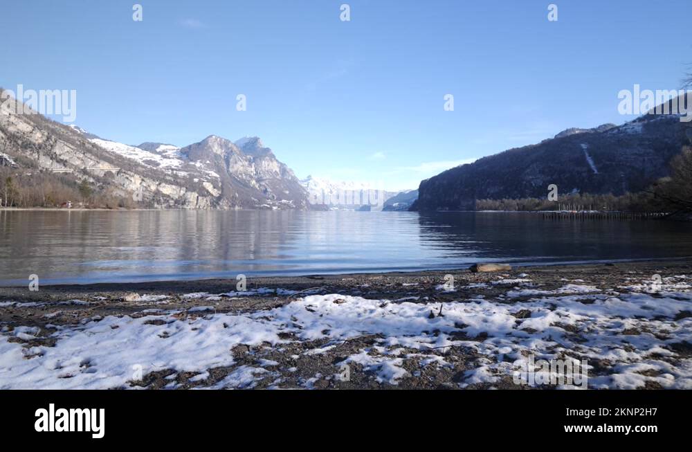 Calm winter scenery on the shore, beach of the beautiful Walensee in ...