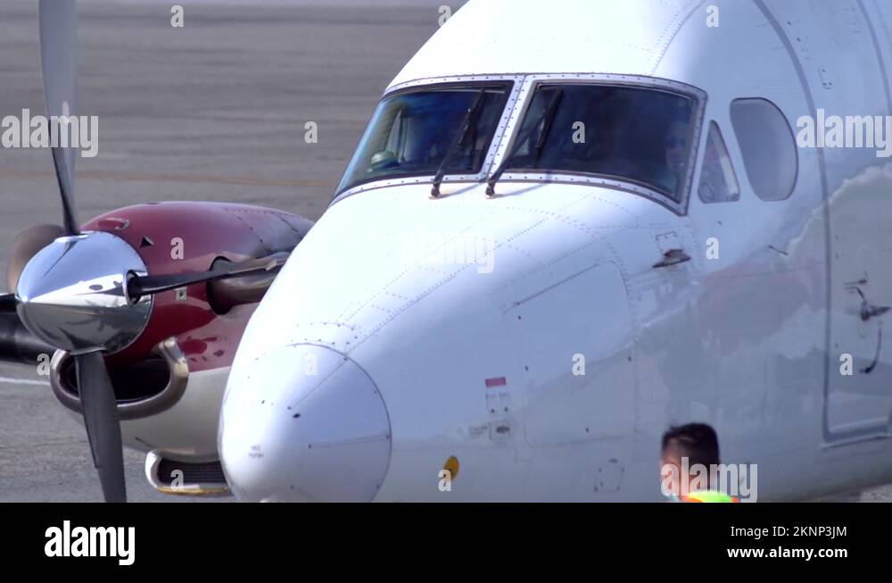 Exterior Shot of Cockpit of a Beech 1900 Turboprop with Ground Crew ...