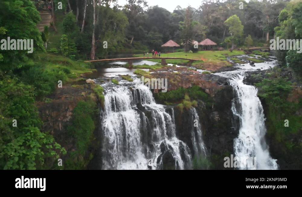 Tad Yuang Waterfalls in Laos during rain, aerial drone revealing view ...