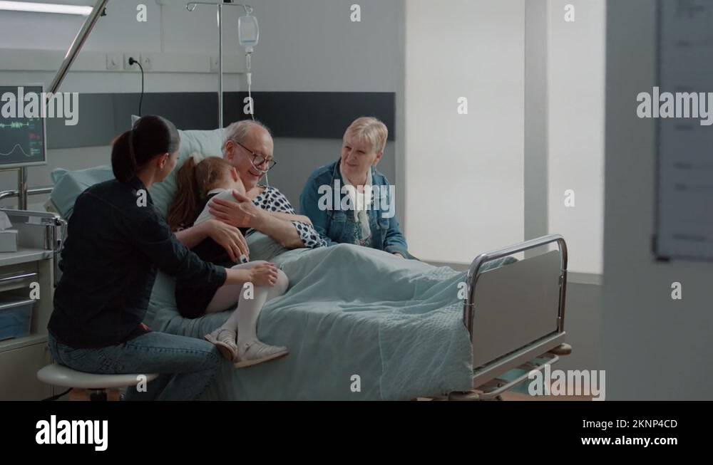 Child hugging sick grandpa in hospital ward bed at visit Stock Video ...