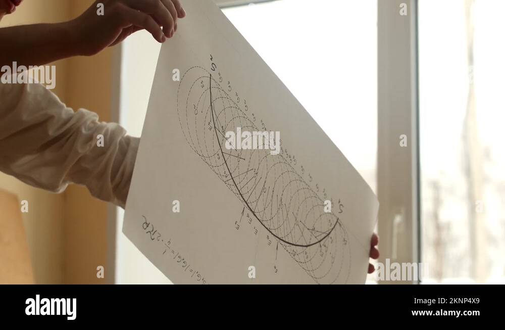 Young mathematician shows paper with inverted arc of cycloid curve ...