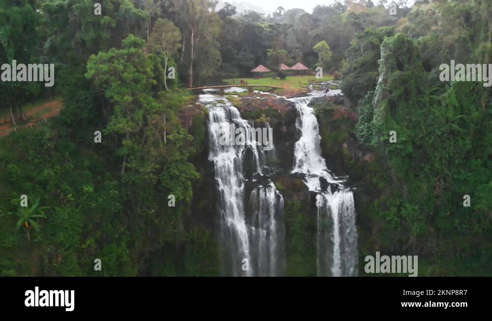 Tad Yuang Waterfalls in Laos during rain, aerial drone revealing view ...