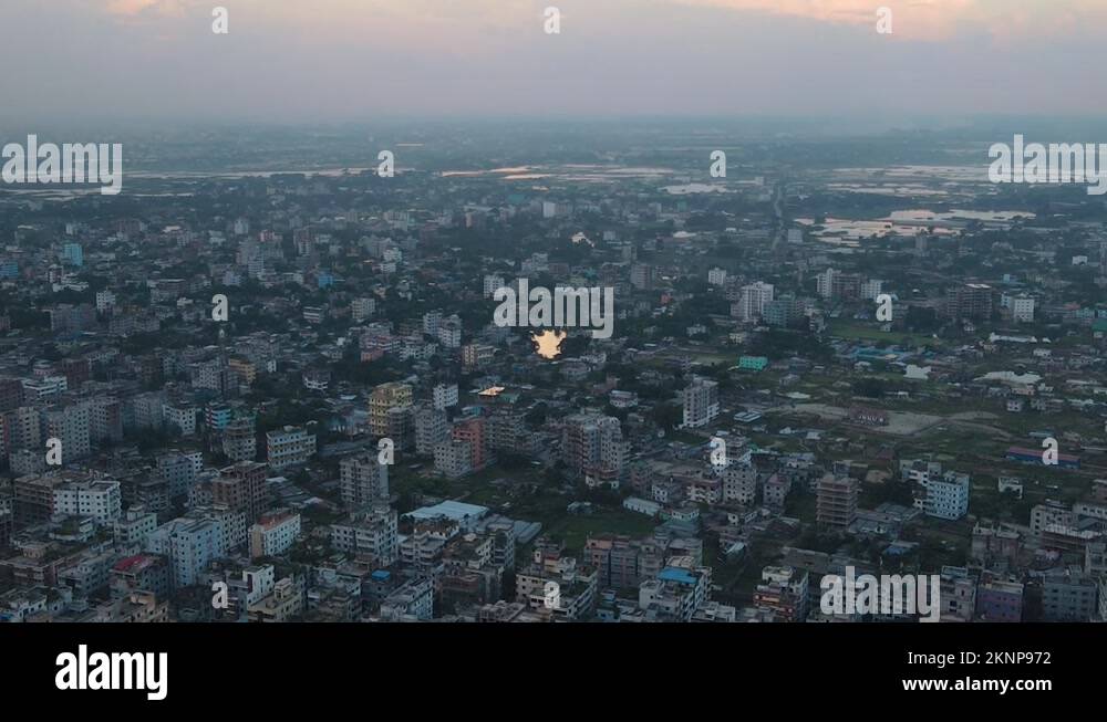 Aerial: city view of urbanization with dense buildings - top zoom out ...