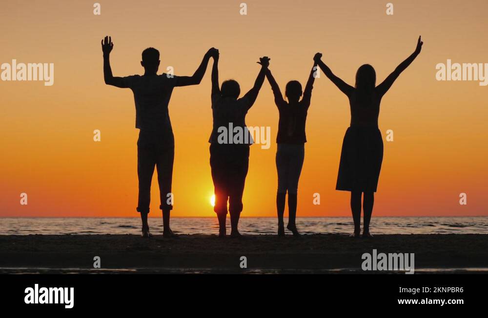 Friendly multi-generational family together raise their hands up Stock ...