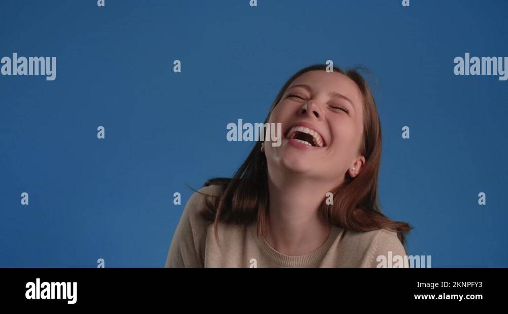 Woman laughs gleefully on the blue screen, chroma key, 4k 60p Prores ...