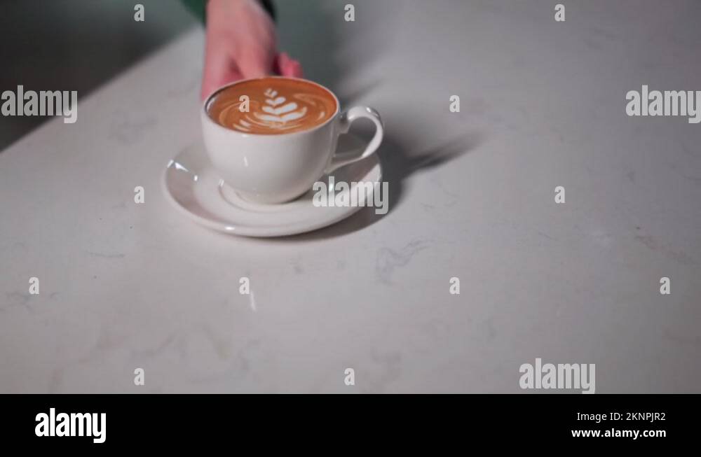Barista Sliding Latte across counter to customer Stock Video Footage ...