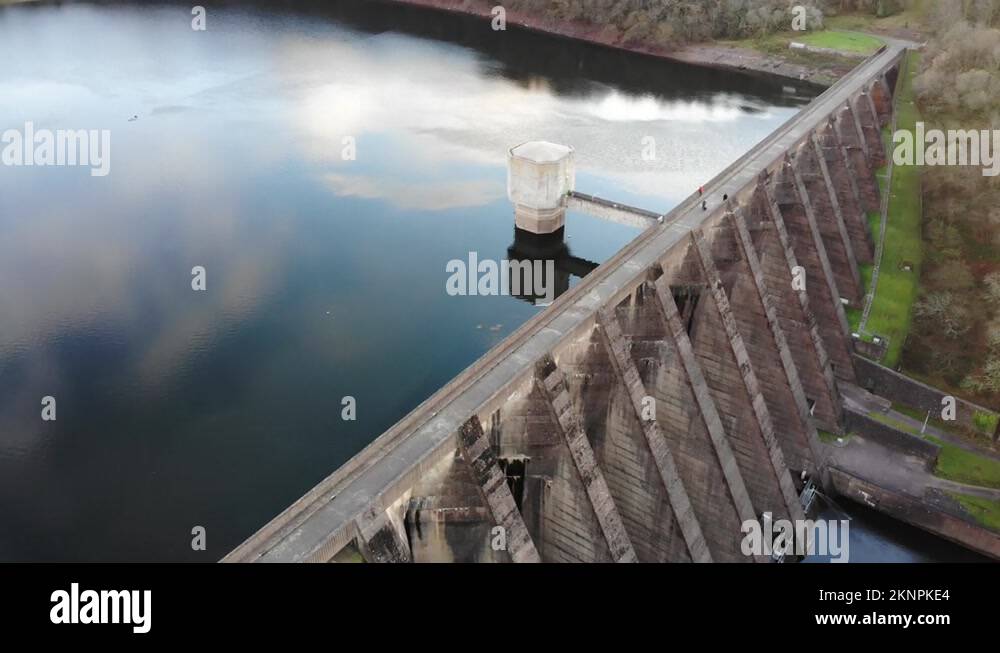 Aerial Of High Walled Concrete Dam At Wimbleball Lake. Dolly Forward ...