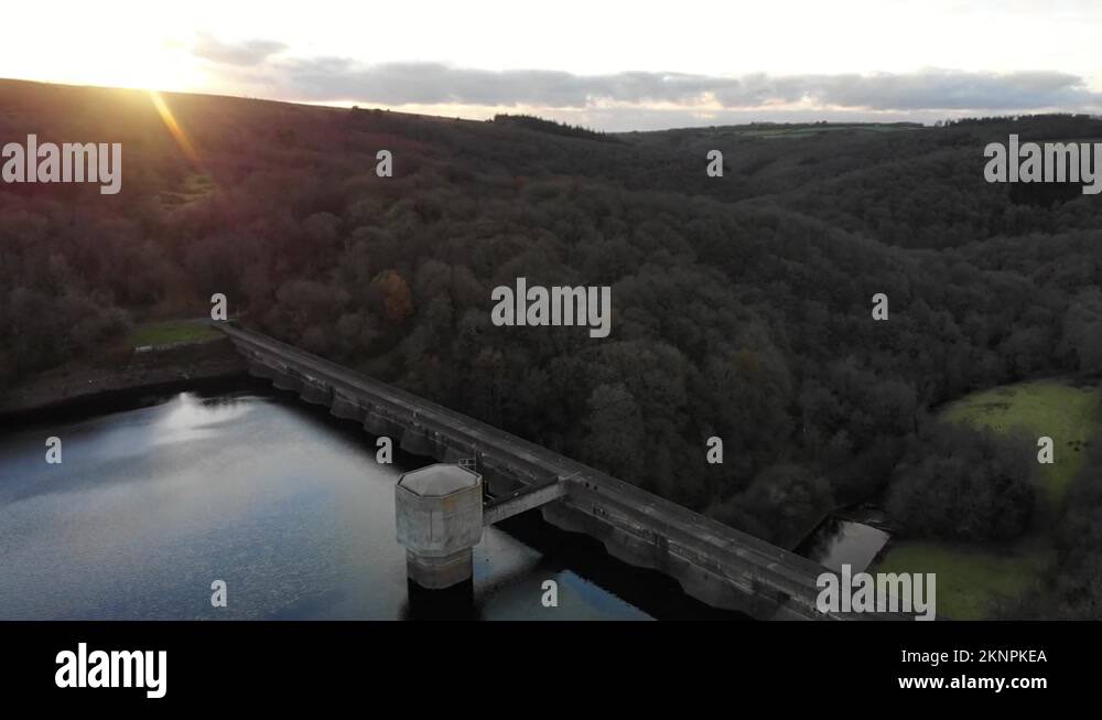 Aerial Over High Walled Concrete Dam At Wimbleball Lake During Sunset ...