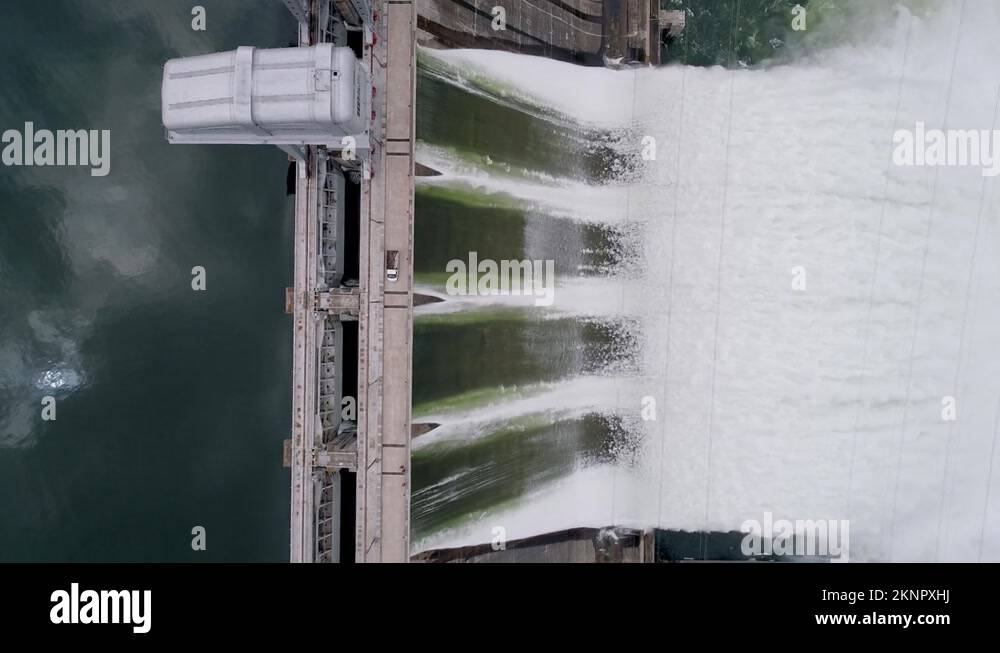 Aerial top down view of water discharge at hydroelectric power plant of ...