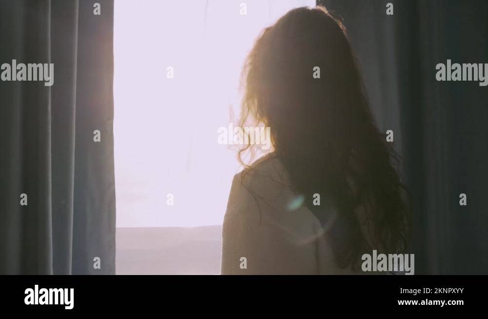 Lady opens curtains look outside Stock Videos & Footage - HD and 4K ...