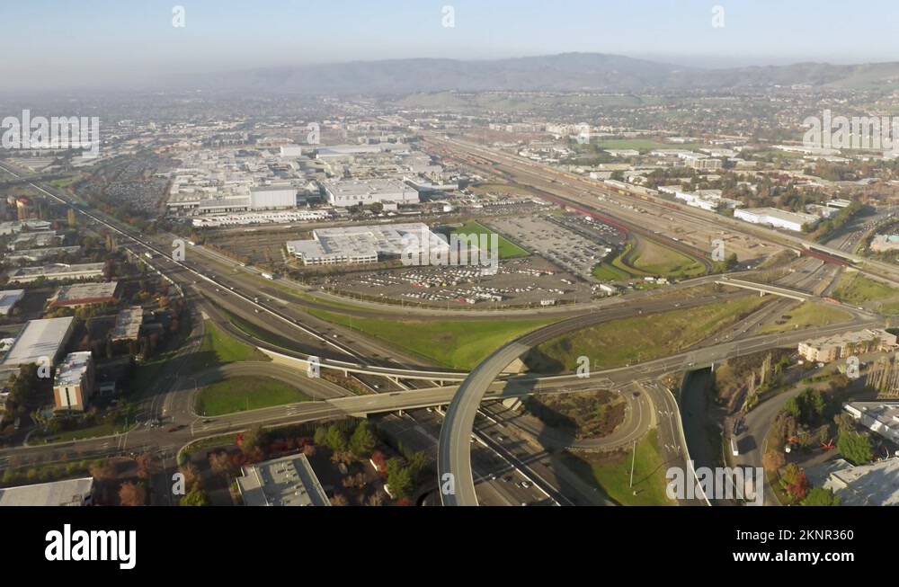 4K aerial view Tesla gigafactory with parking lot for new electric ...