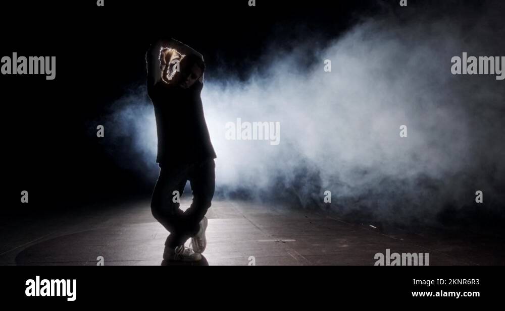 Teenage female dancer performing hip hop dance in slow motion with ...