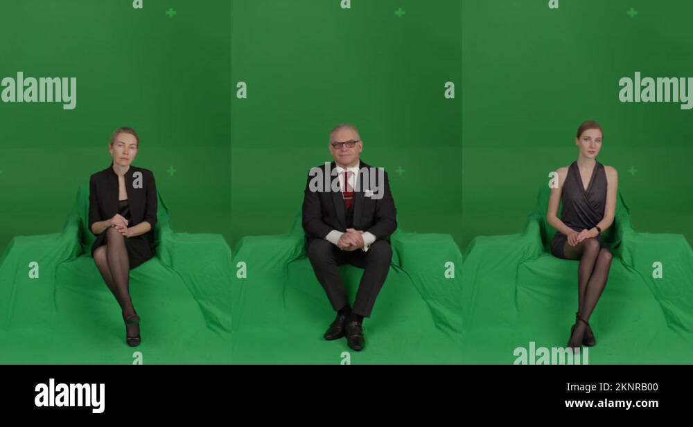 GREEN SCREEN CHROMA KEY Spectators wearing formal attire watching ...