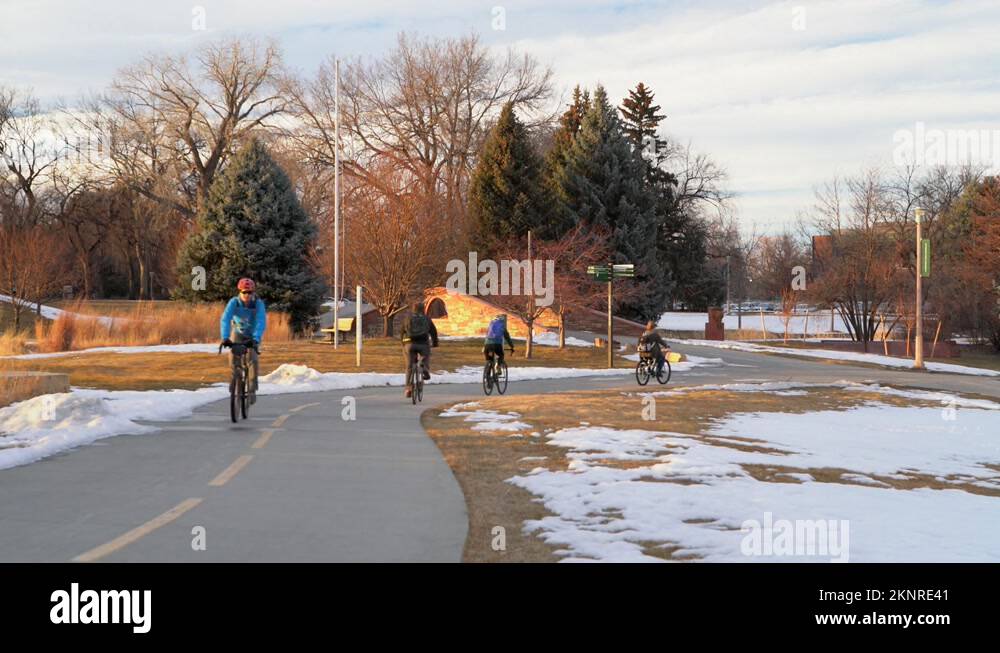 Students are riding bikes and walking on a bike trail near CSU campus ...