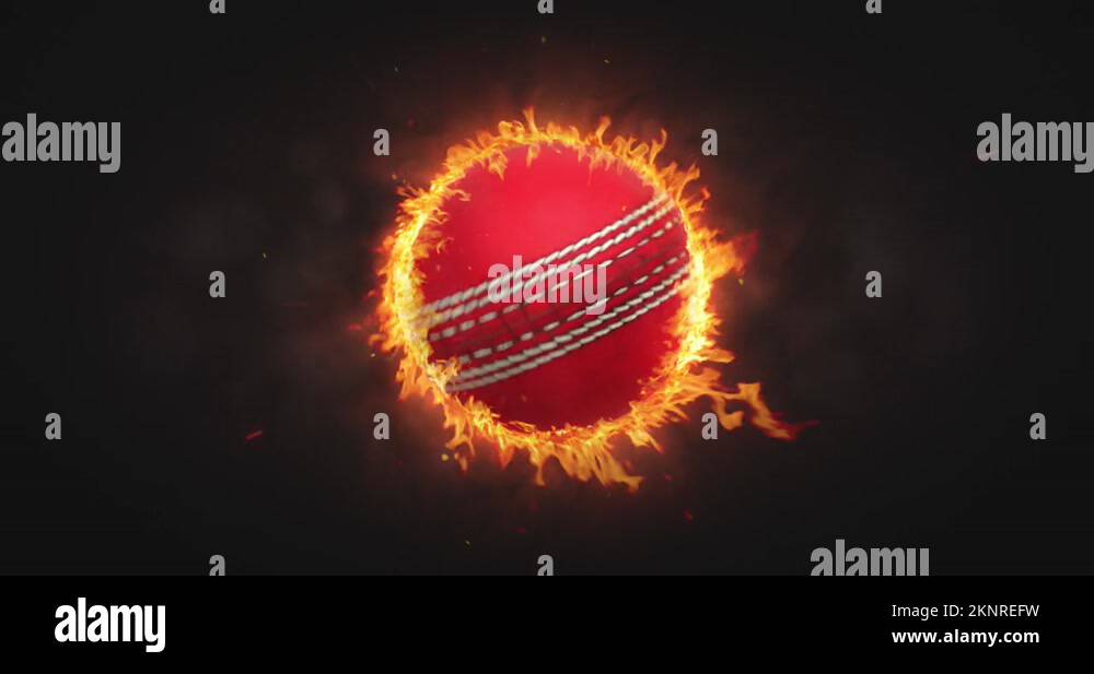Rotating red cricket ball in burning fire flames on dark background ...