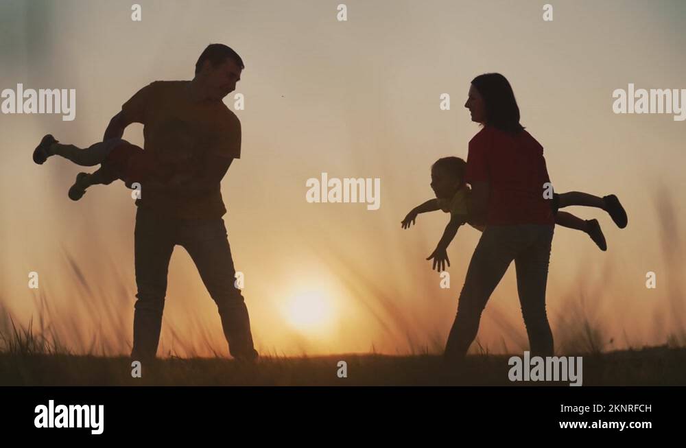 Happy family.Parents and children play on grass in field.Family ...