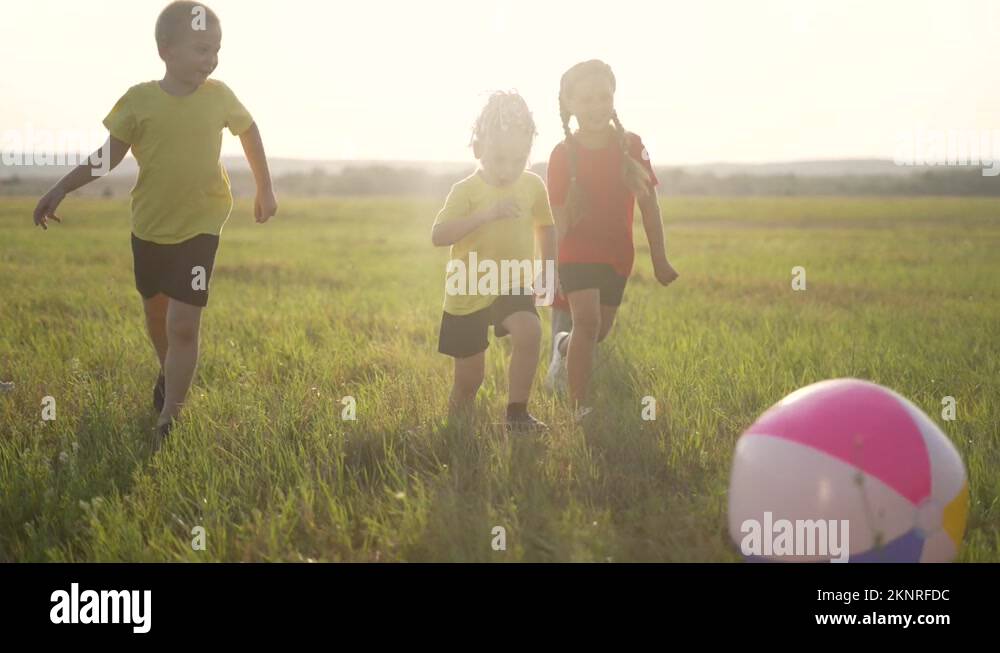 Happy children in summer in park. Preschool kids with soccer ball in ...