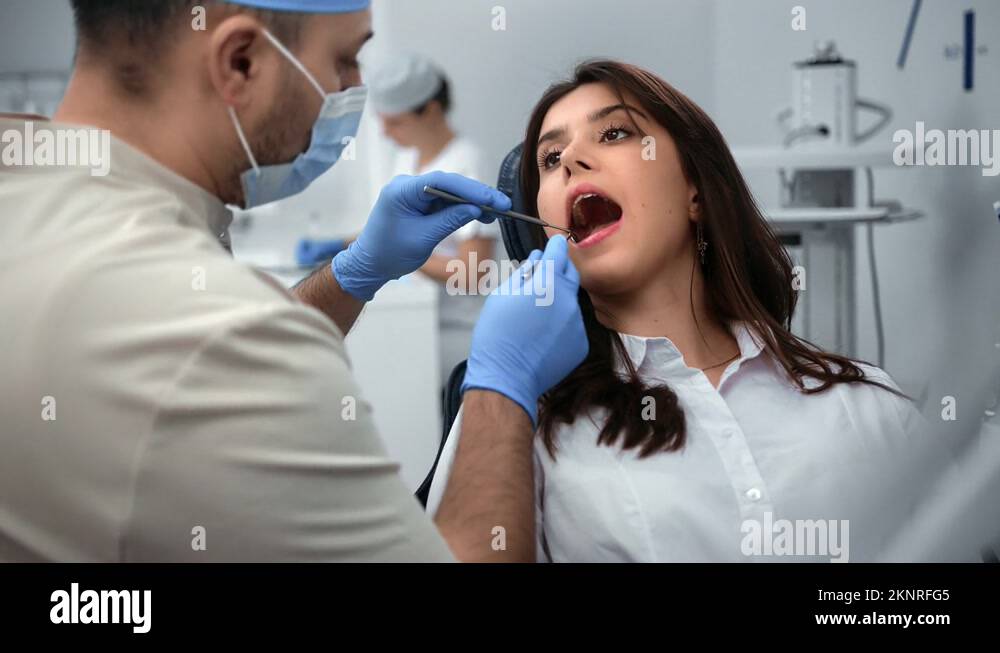 Woman patient with toothache visit stomatologist checkup exam sitting ...
