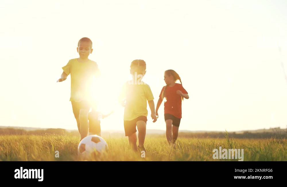 Happy family of children run across field. Group of children are ...
