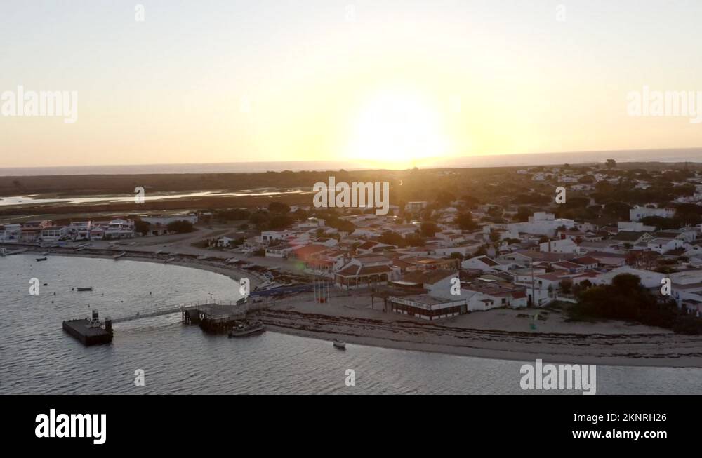 Sunset Over Pier And Beachfront Houses On The Armona Island Along The ...