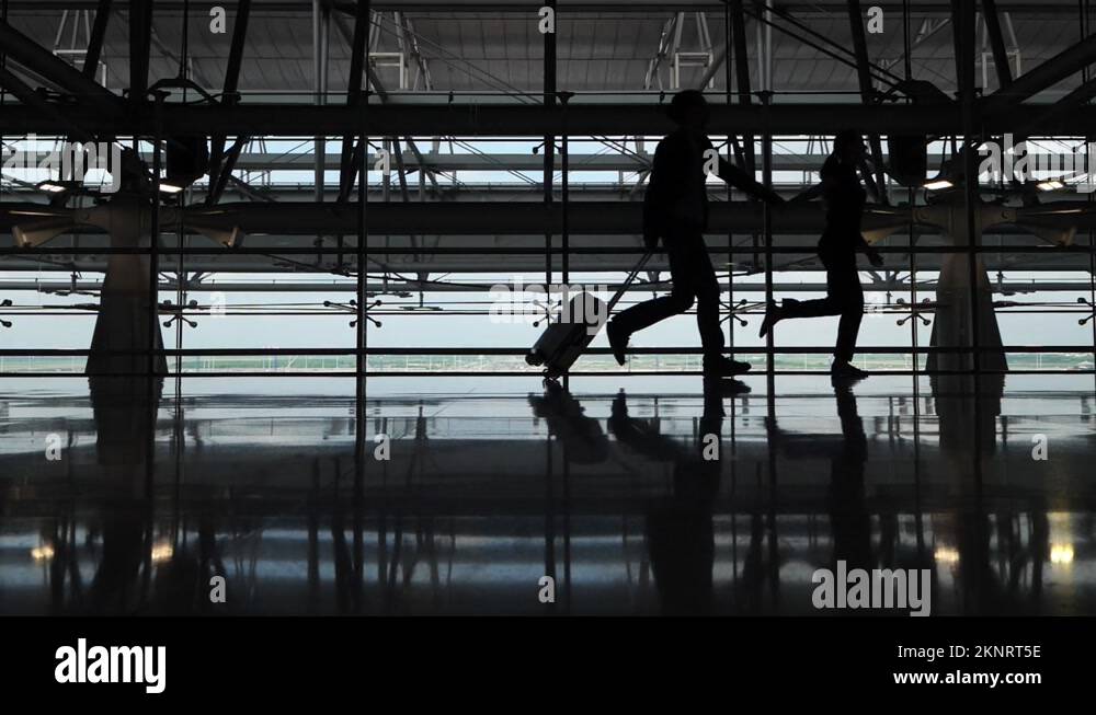 Man woman running through airport Stock Videos & Footage - HD and 4K ...