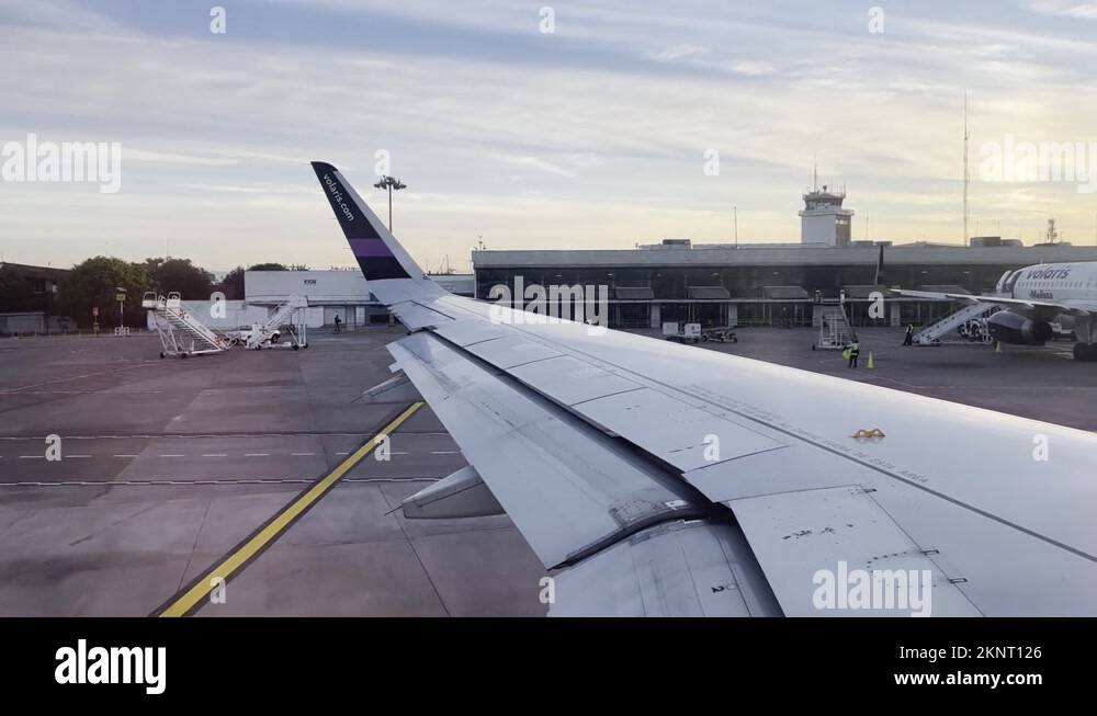Airplane wing on the runways ramp taxiways at GDL airport Stock Video ...