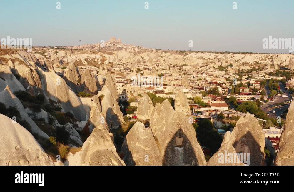 Beautiful long aerial background of authentic small sunny town among ...