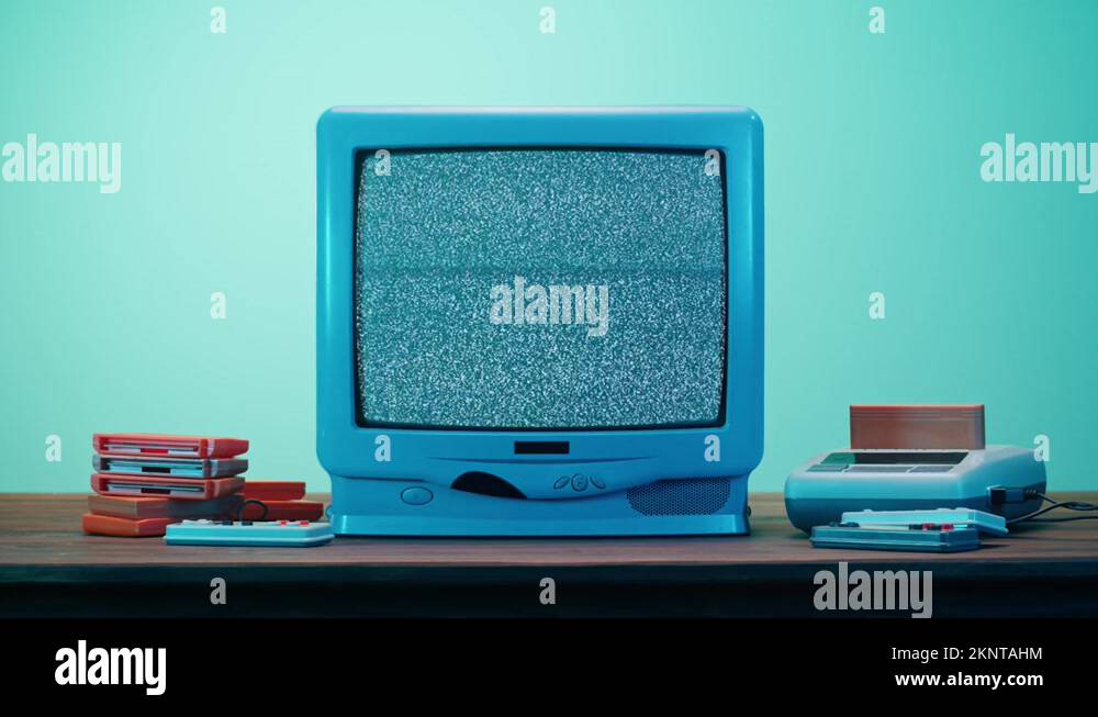 Old television with grey interference screen on blue neon background ...