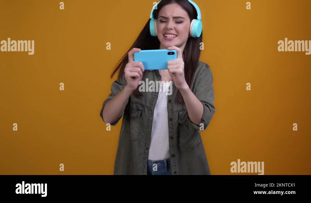 Sad girl play speed race game lose isolated bright color background ...