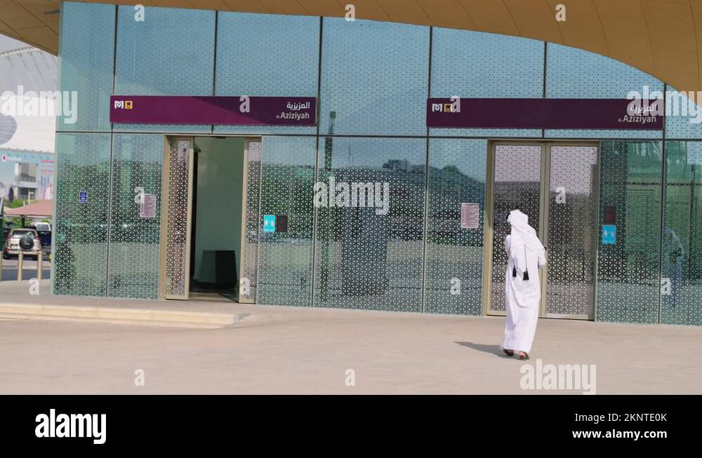 Qatari man walking in front Aziziyah metro station in Doha Qatar Stock ...