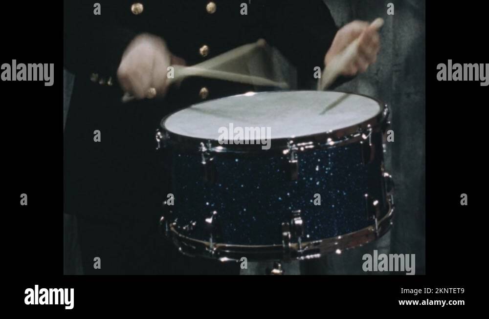 1950s: Hands holding drum sticks, drumming on snare drum. Hands ...
